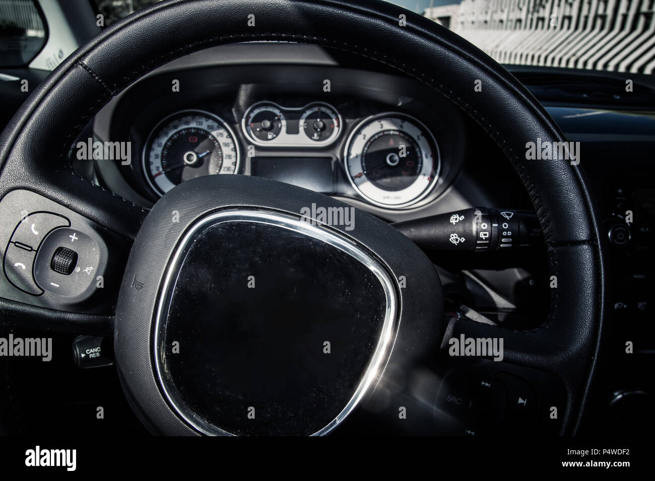 Closeup of car steering wheel and dashboard. Modern car interior ...