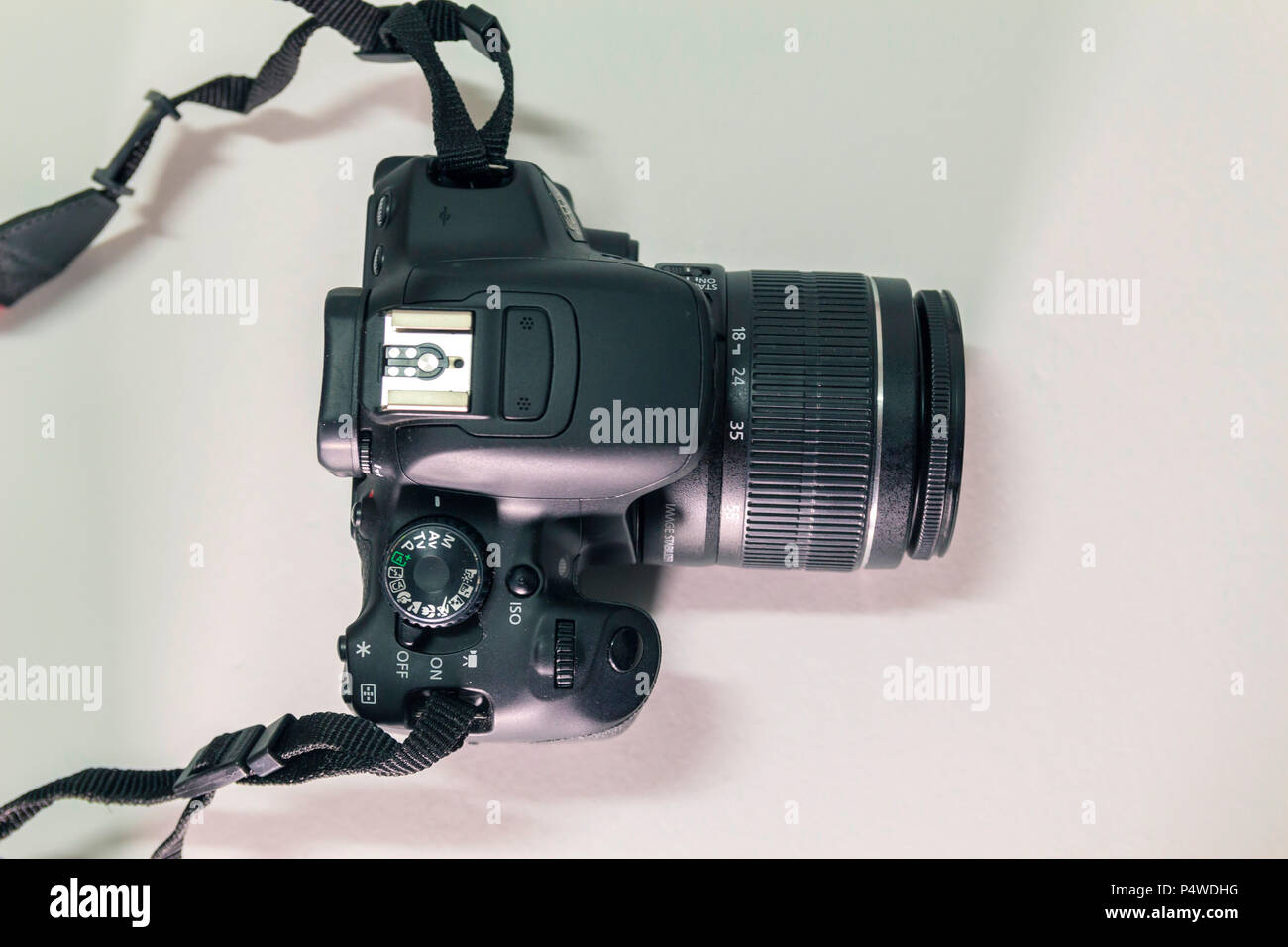 Closeup top view of modern black DSLR camera on white background Stock ...