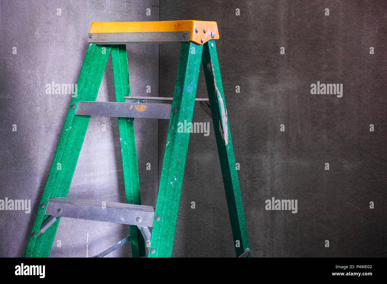 Step ladder in the corner of a house Stock Photo - Alamy