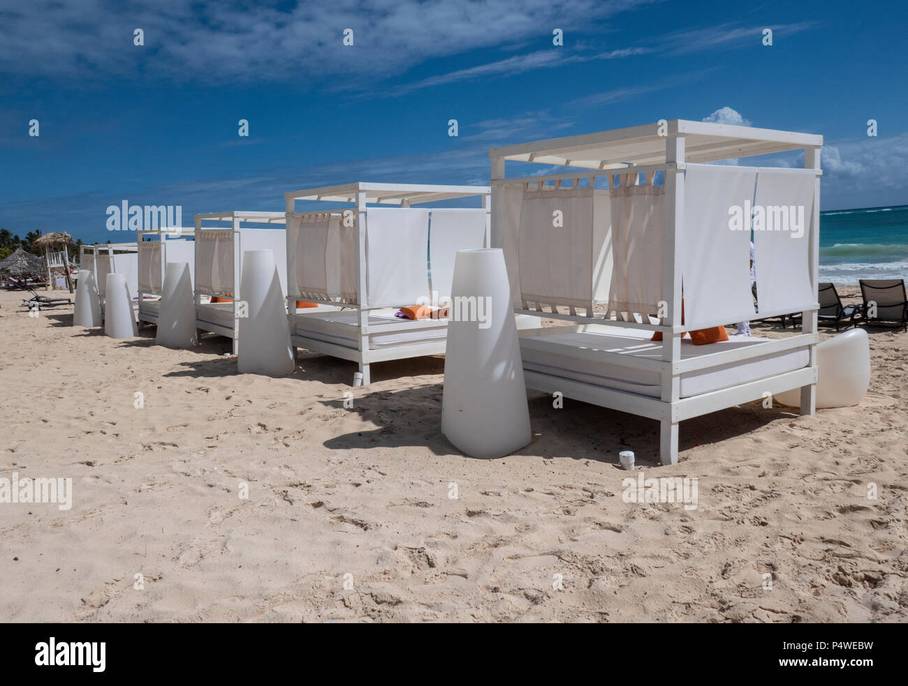 Balinese beds ina a caribbean beach Stock Photo - Alamy
