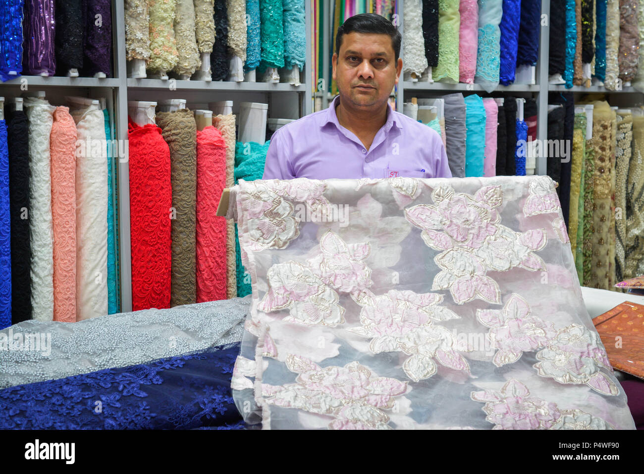 man showcasing textile Stock Photo - Alamy