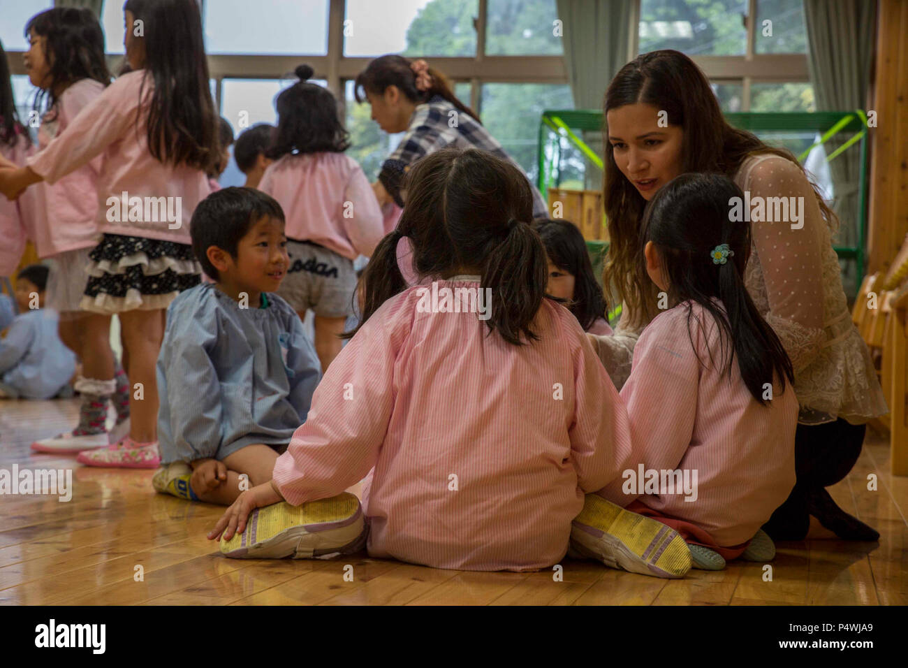 Michelle Hene, a volunteer with the Marine Memorial Chapel, plays games ...