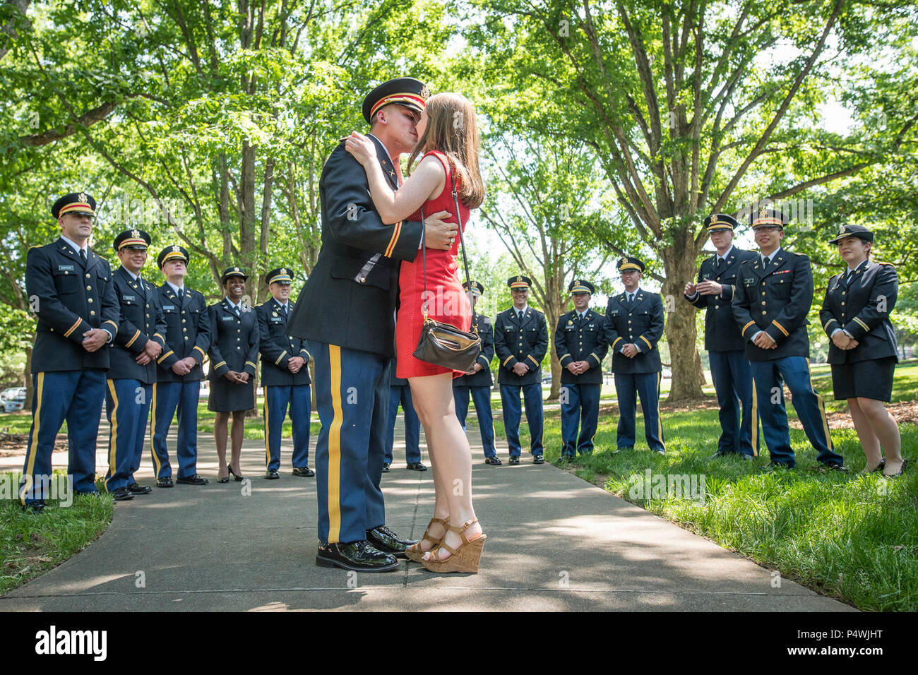 Brand new U.S. Army 2nd Lt. Allen Robertson kisses his fiance, Chelsea ...