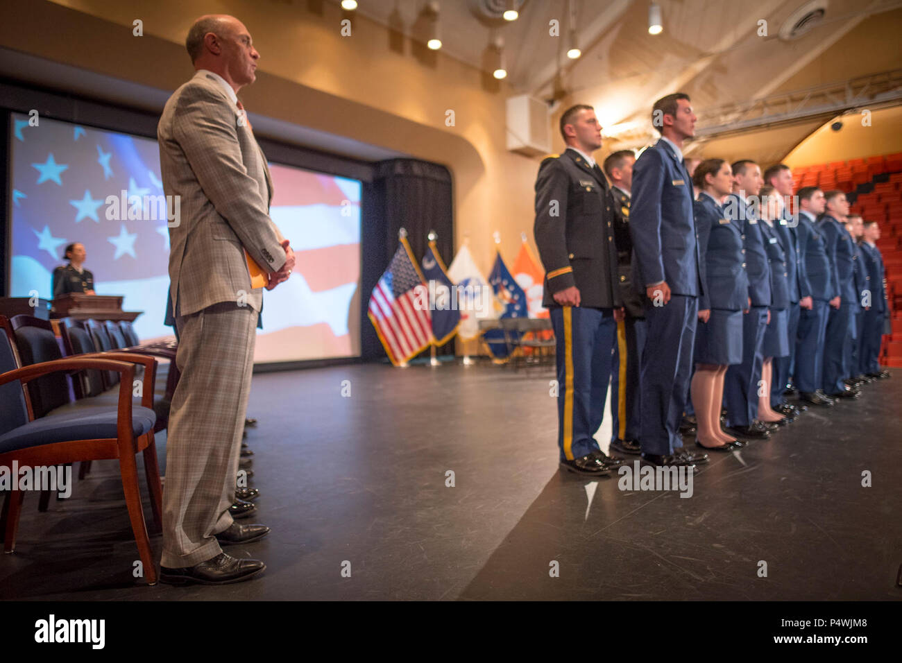 Clemson University president James Clements (left) sings the alma mater ...