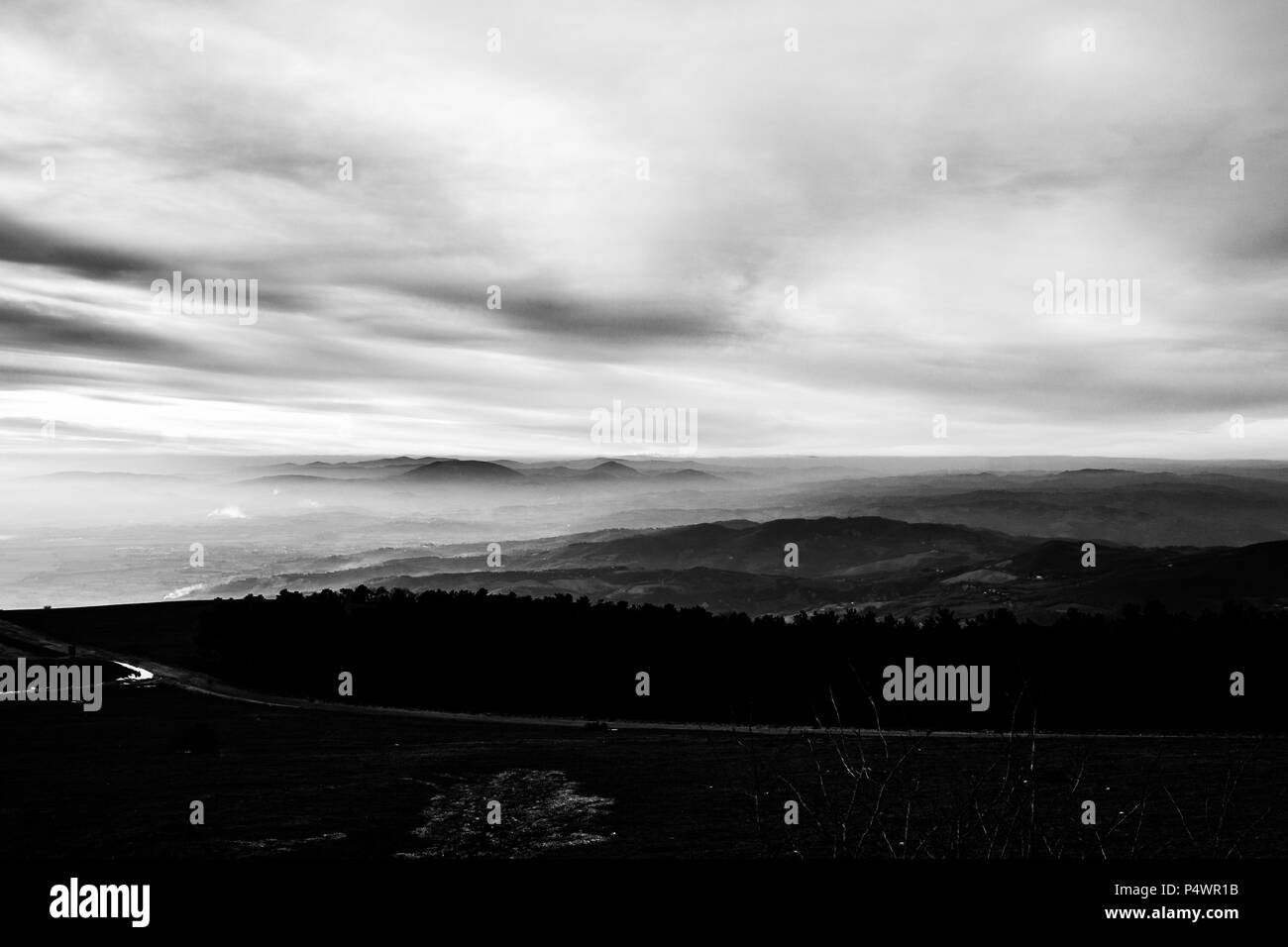 Subasio Mt. (Umbria, Italy), with sky covered by clouds and mist on the ...