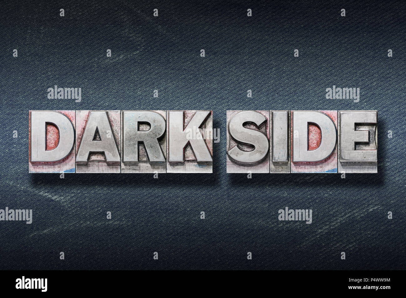 dark side phrase made from metallic letterpress on dark jeans ...