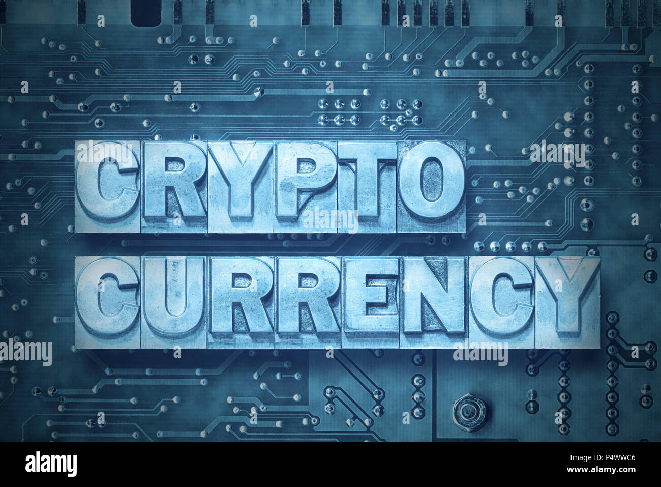crypto currency phrase made from metallic letterpress blocks on the pc ...