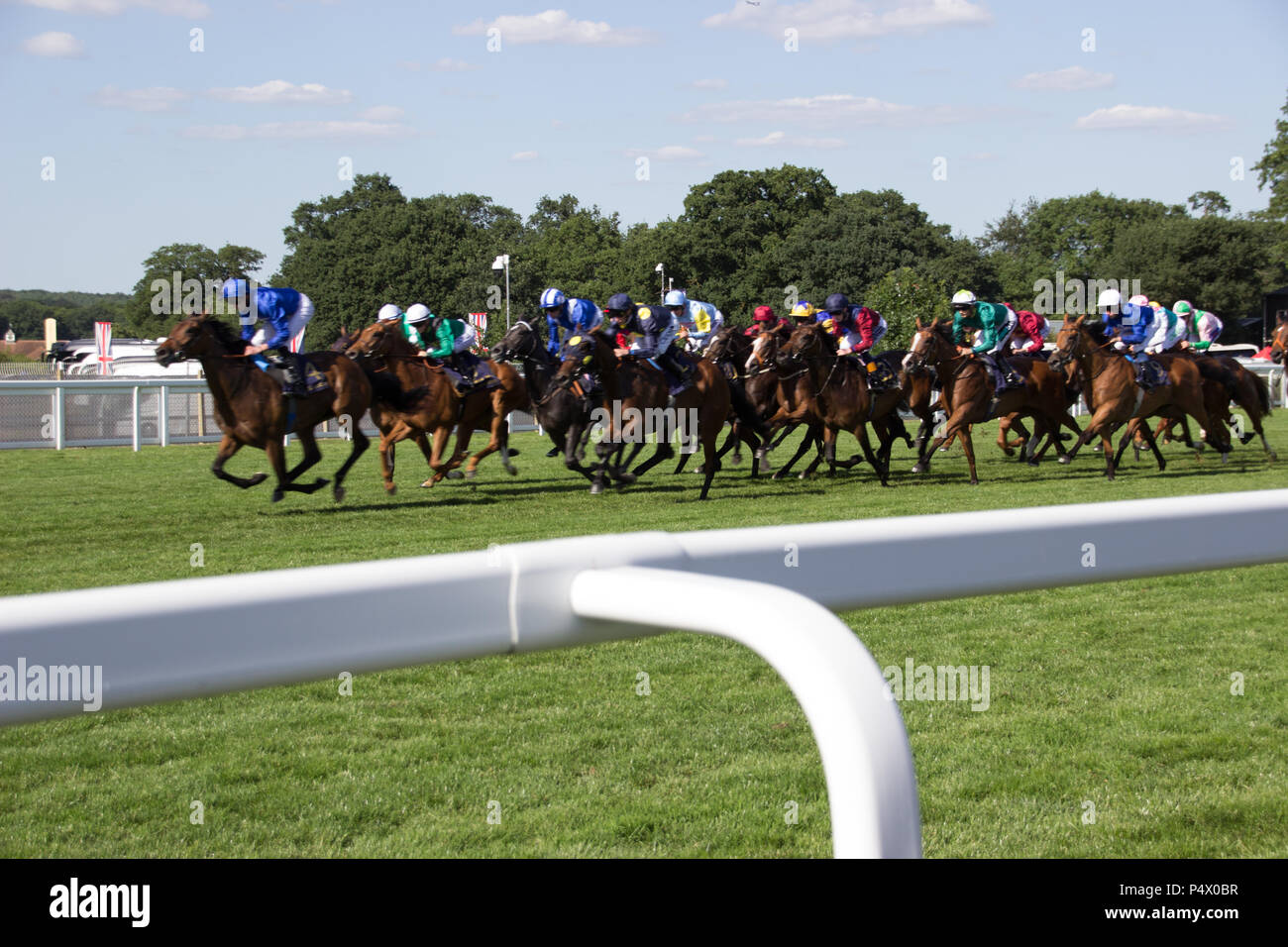 Horses racing on track at Royal Ascot Stock Photo - Alamy