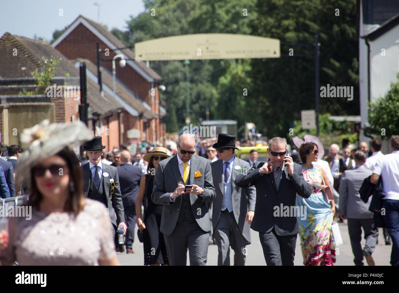 crowds walking towards entrance at Royal Ascot, men in top hat and ...