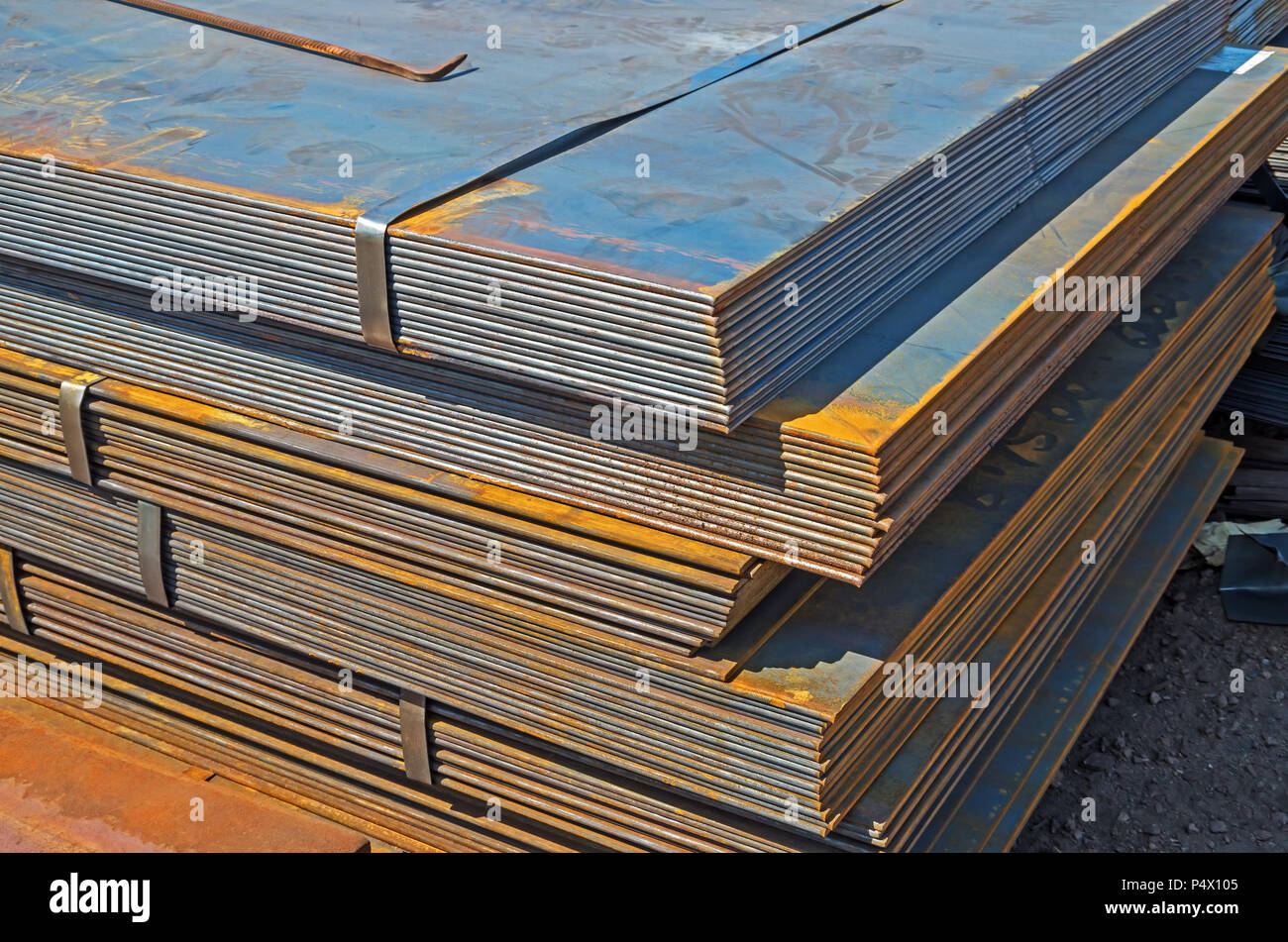 The rusty hot-rolled sheet metal in packs at the warehouse of metal ...