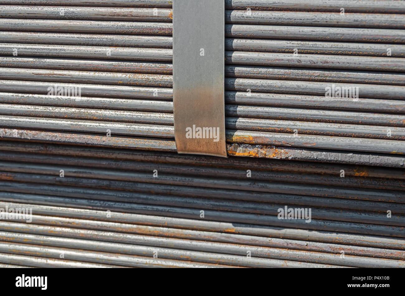 The rusty hot-rolled sheet metal in packs at the warehouse of metal ...