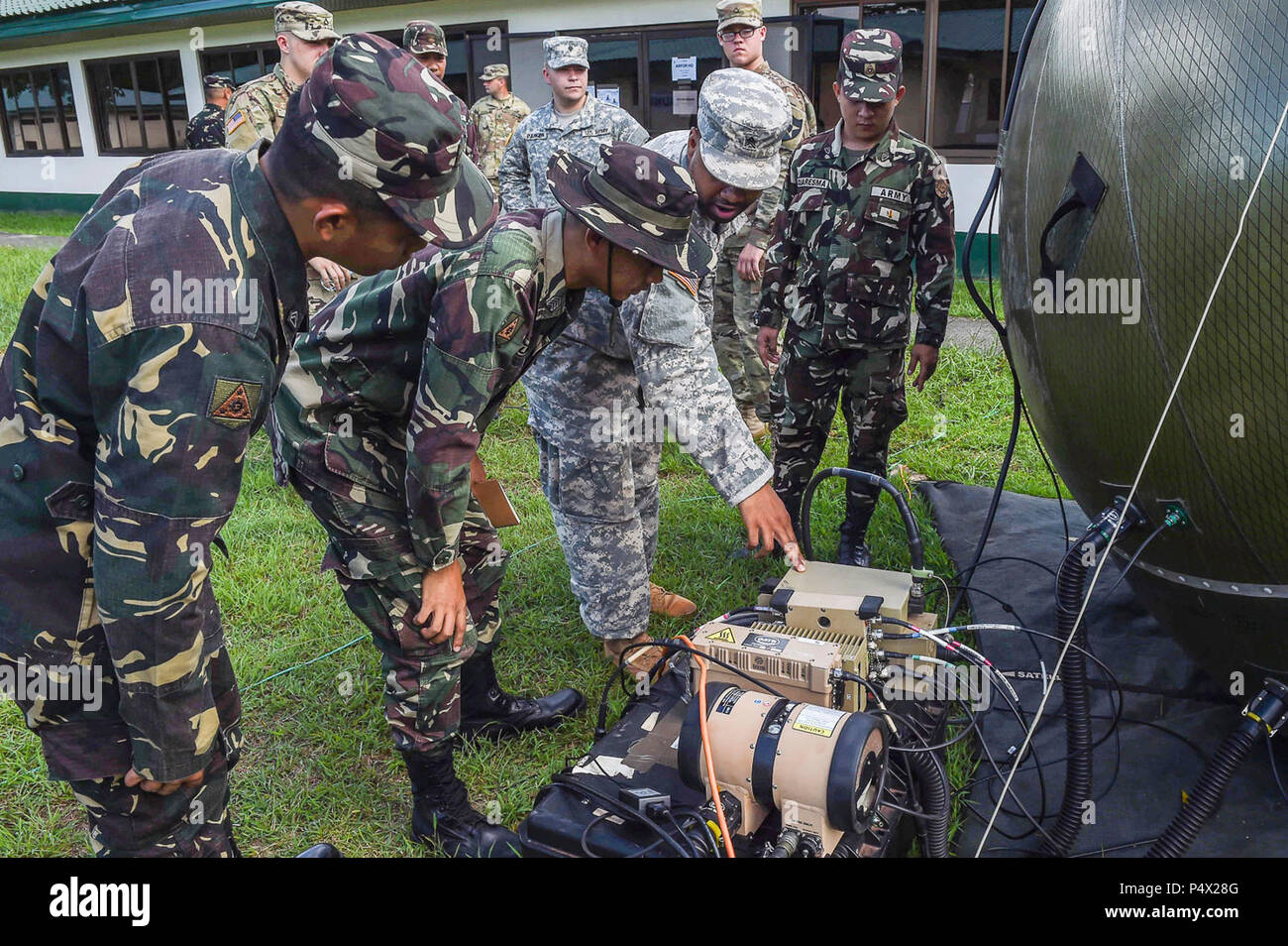 U.S. Army Sgt. Marc Calder, center, 25th Infantry Division, discusses ...