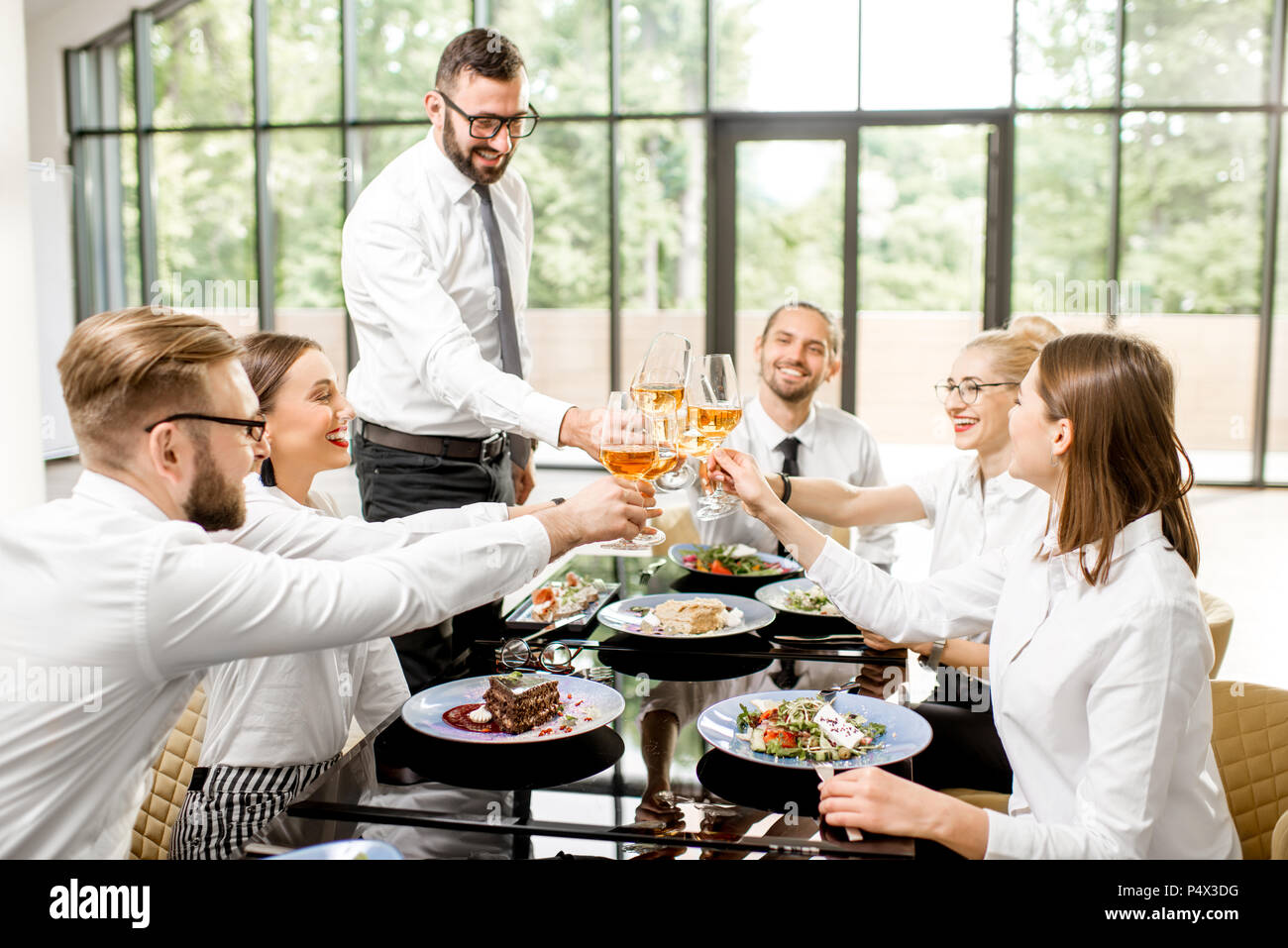 Business people during a lunch at the restaurant Stock Photo - Alamy