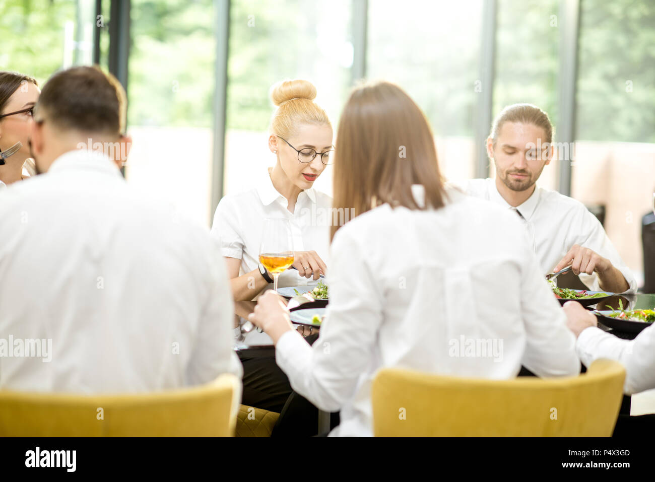 Business people during a lunch at the restaurant Stock Photo - Alamy