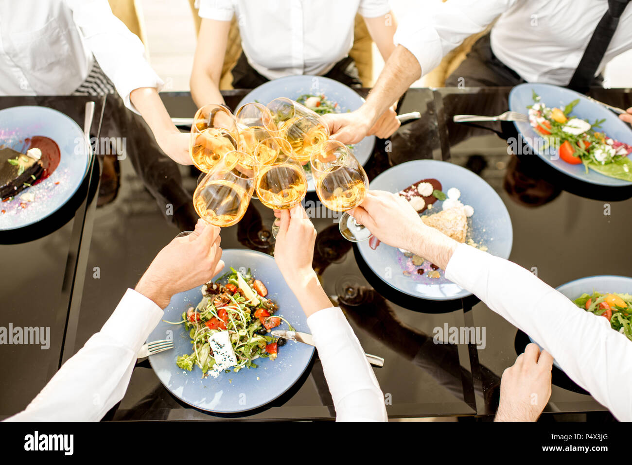 Business people during a lunch at the restaurant Stock Photo - Alamy