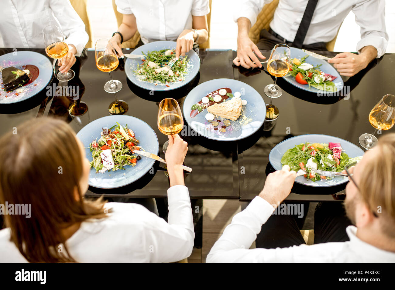 Business people during a lunch at the restaurant Stock Photo - Alamy