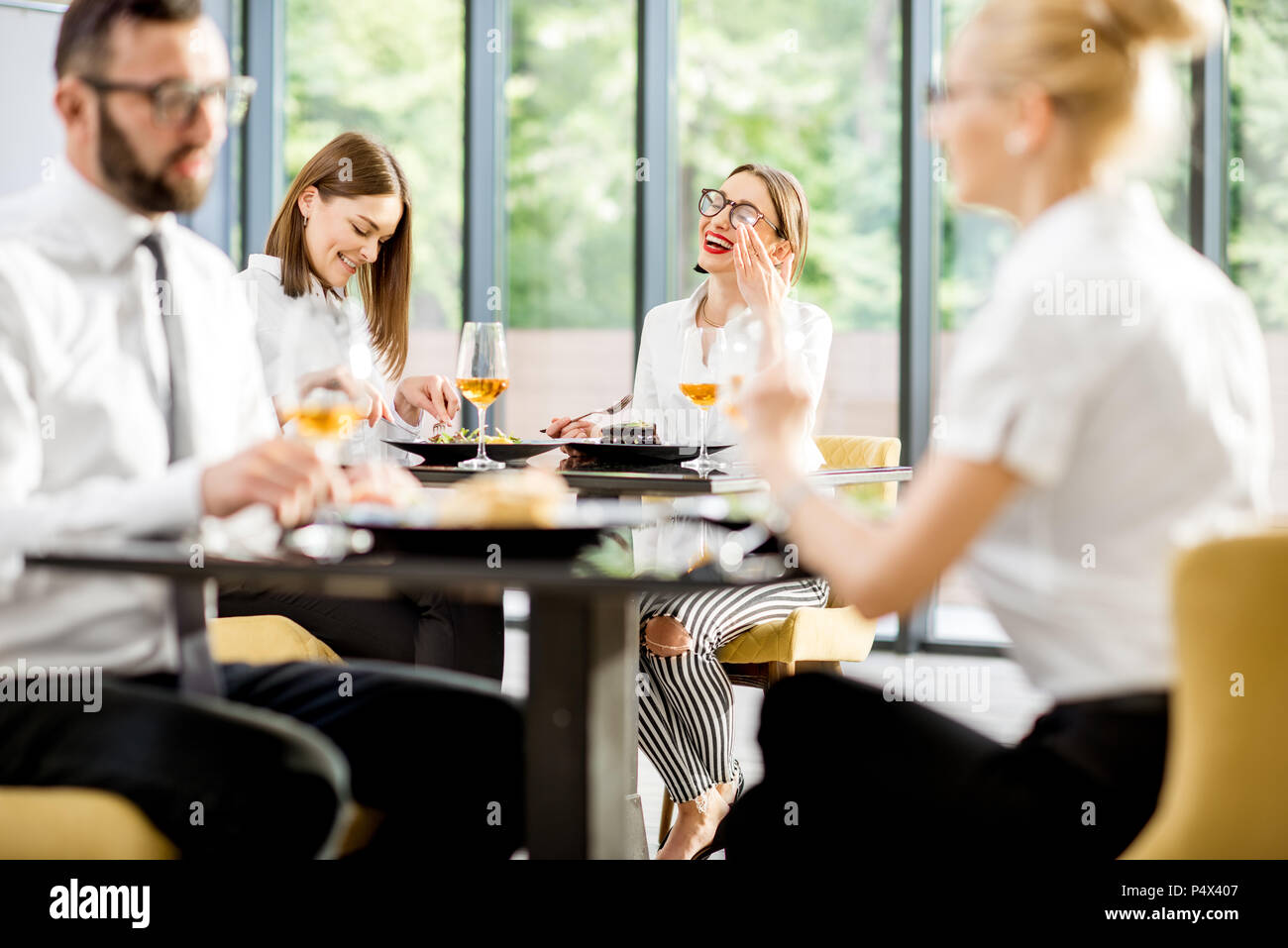 Business people during a lunch at the restaurant Stock Photo - Alamy
