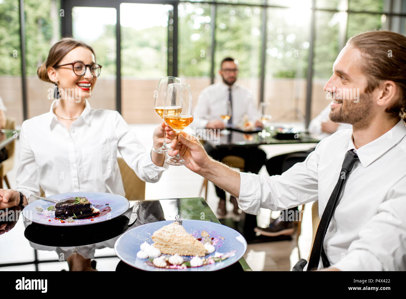 Business people during a lunch at the restaurant Stock Photo - Alamy