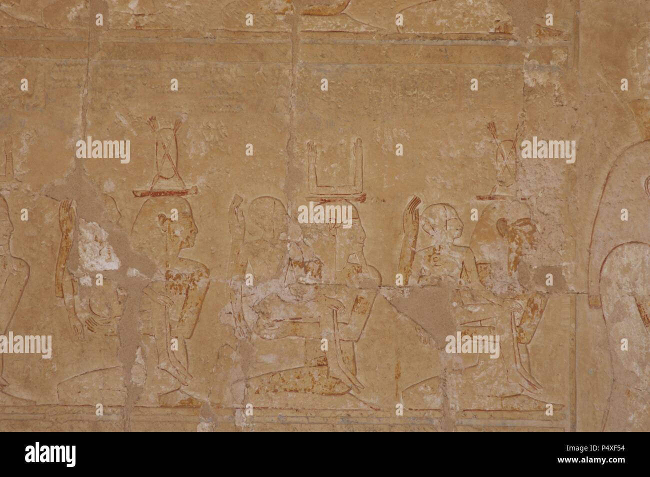 Reliefs depicting a kneeling woman with a child and carrying on her ...