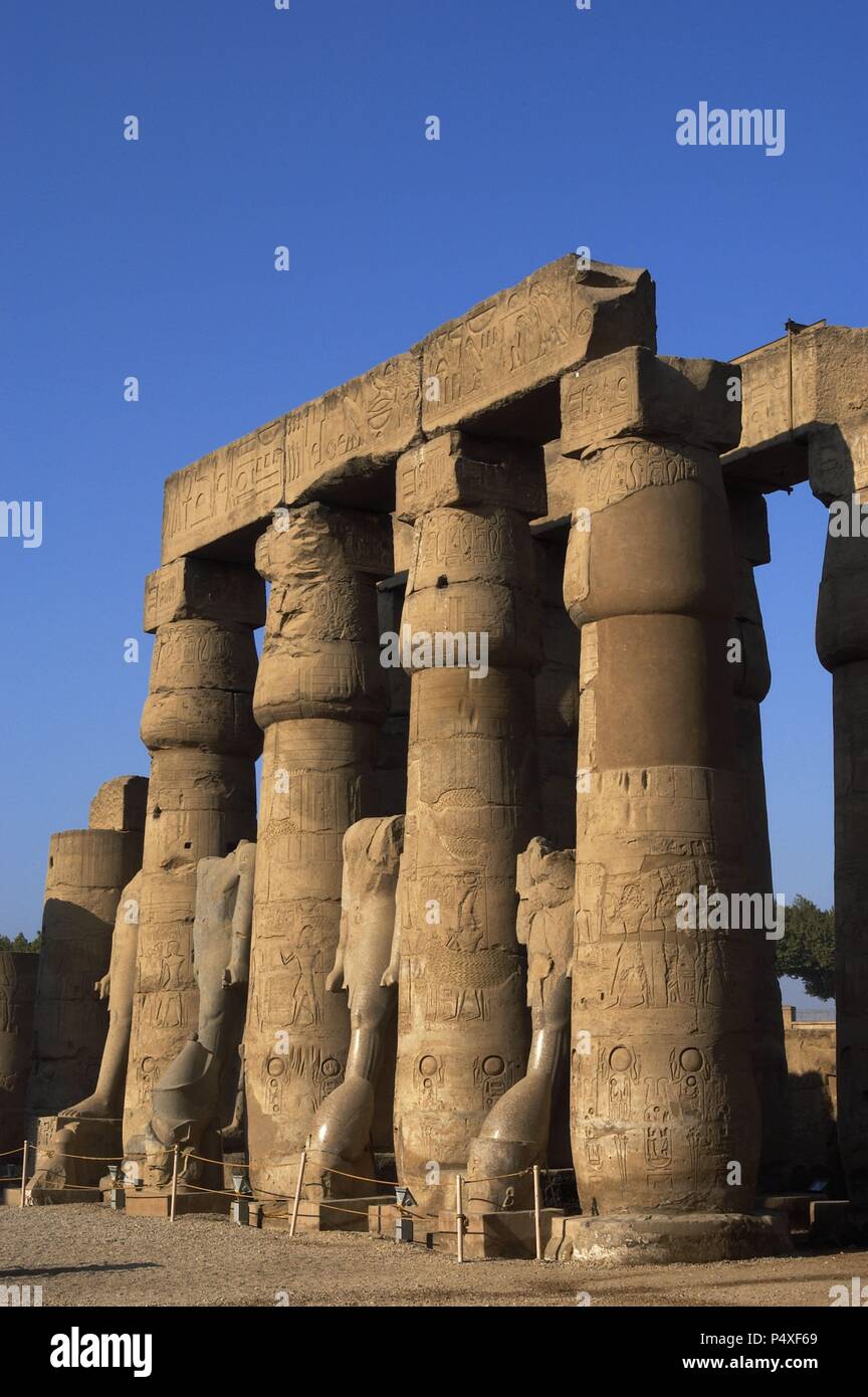 Temple of Luxor. Smooth shaft columns with closed papyrus capitals of ...