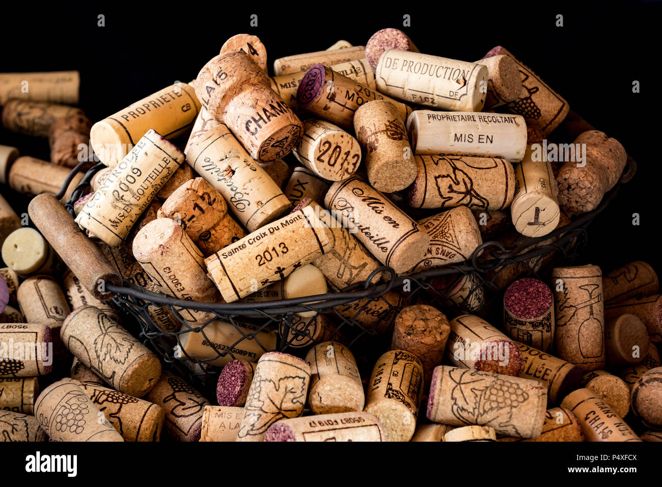 old cork stoppers of French wines in a wire basket Stock Photo - Alamy
