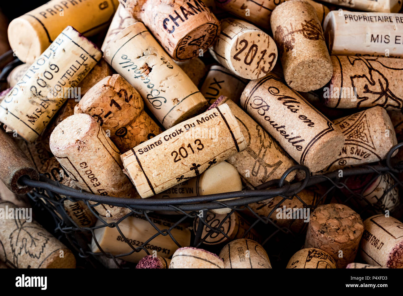 old cork stoppers of French wines in a wire basket Stock Photo - Alamy