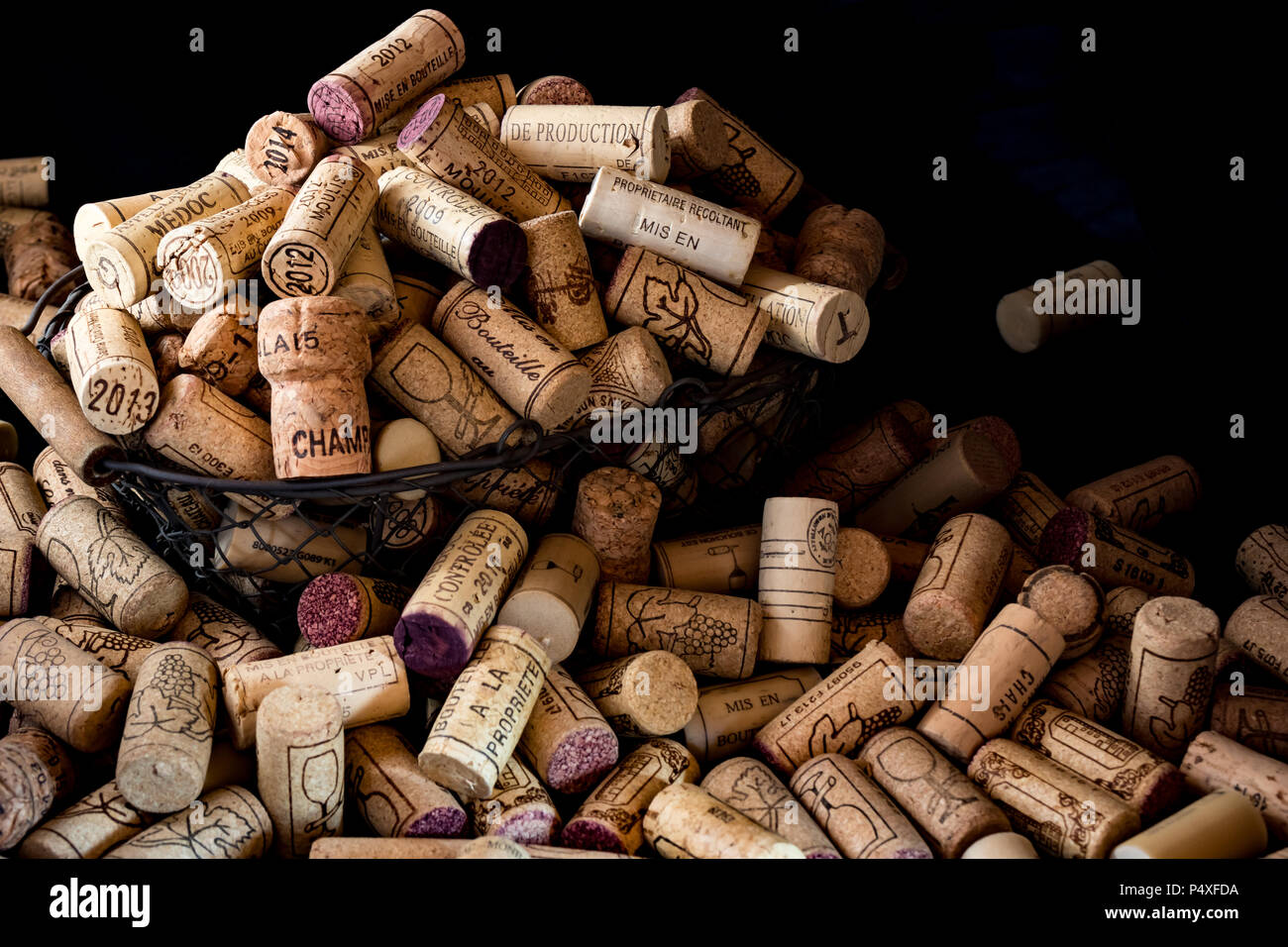 old cork stoppers of French wines in a wire basket Stock Photo - Alamy