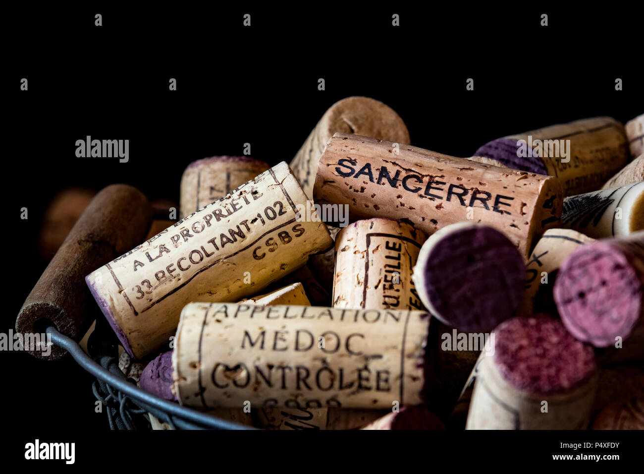 old cork stoppers of French wines in a wire basket Stock Photo - Alamy