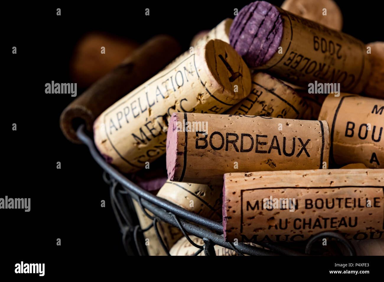 old cork stoppers of French wines in a wire basket Stock Photo - Alamy