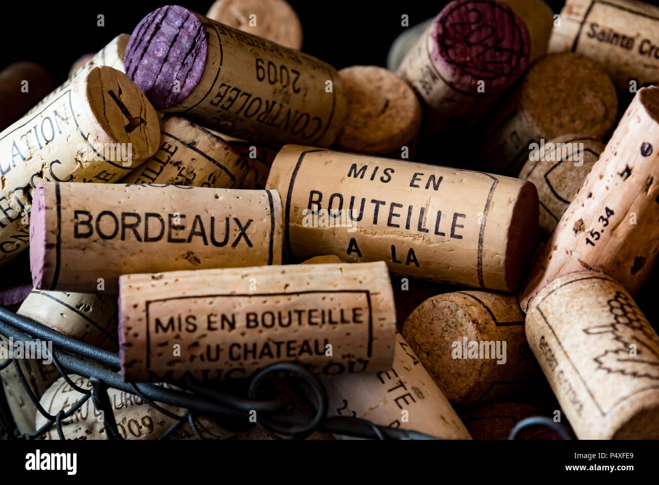 old cork stoppers of French wines in a wire basket Stock Photo - Alamy