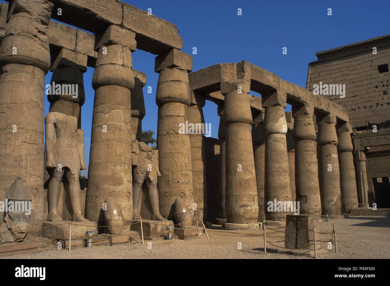 Temple of Luxor. Smooth shaft columns with closed papyrus capitals of ...