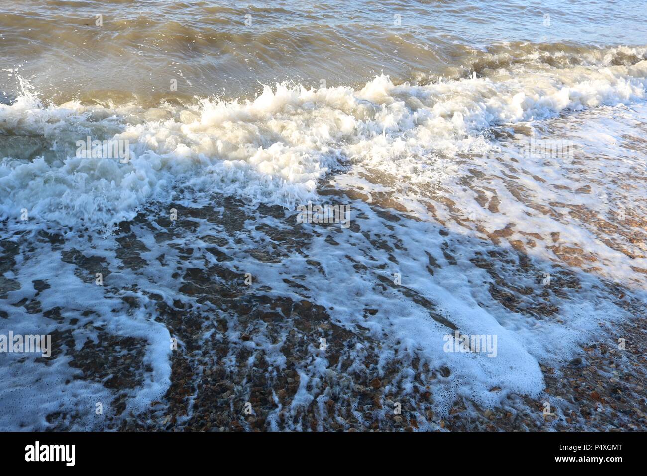 Small waves at shoreline hi-res stock photography and images - Alamy