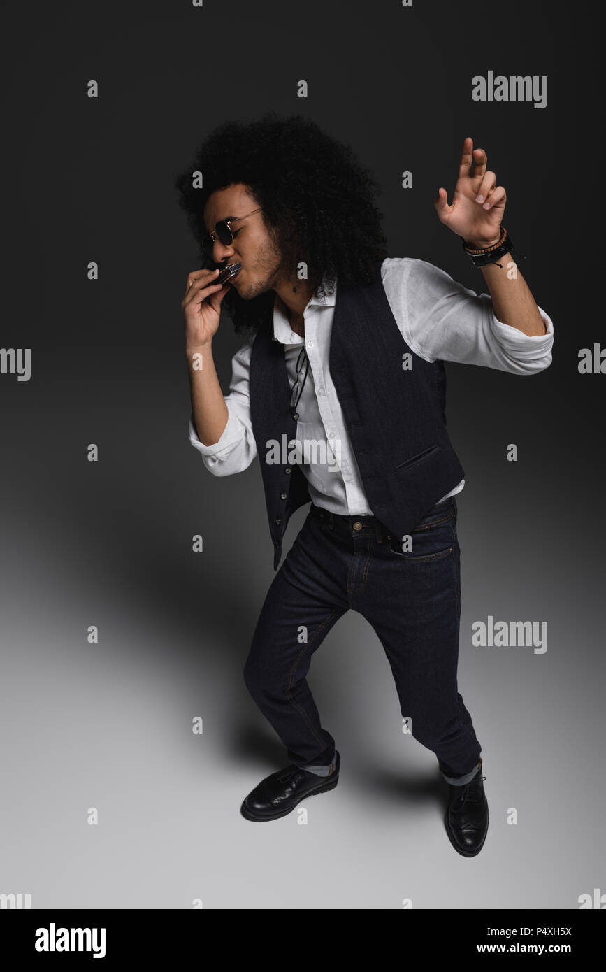 Harmonica afro hi-res stock photography and images - Alamy