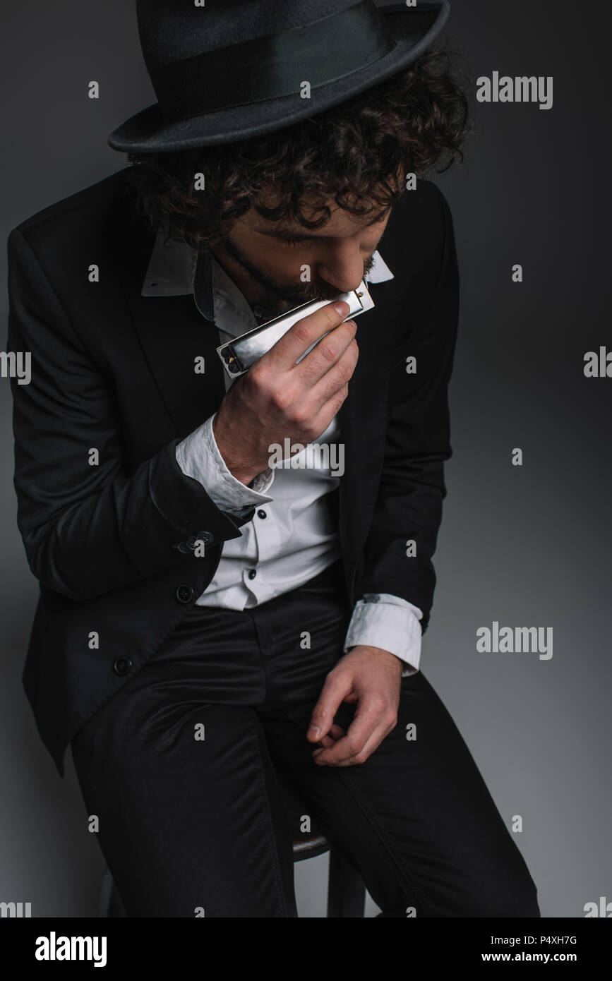 Musician playing harmonica hi-res stock photography and images - Alamy