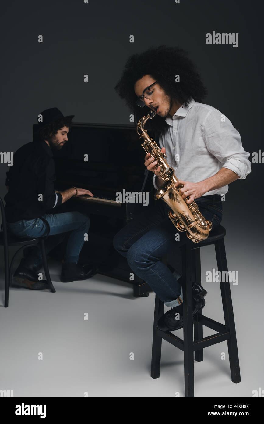 duet of musicians on black Stock Photo - Alamy