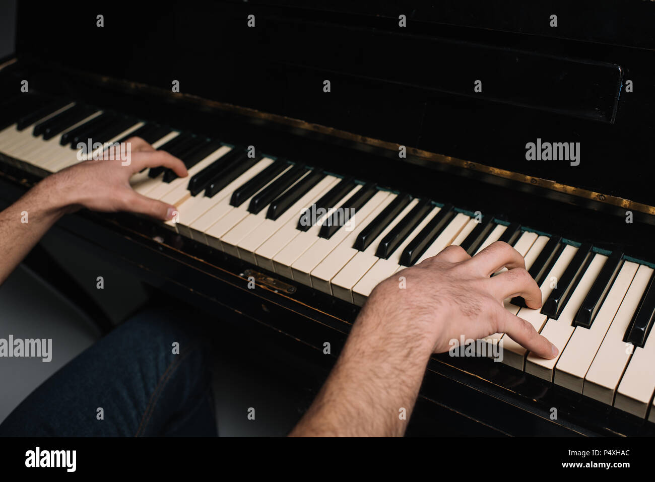 Male musician playing upright piano hi-res stock photography and images ...