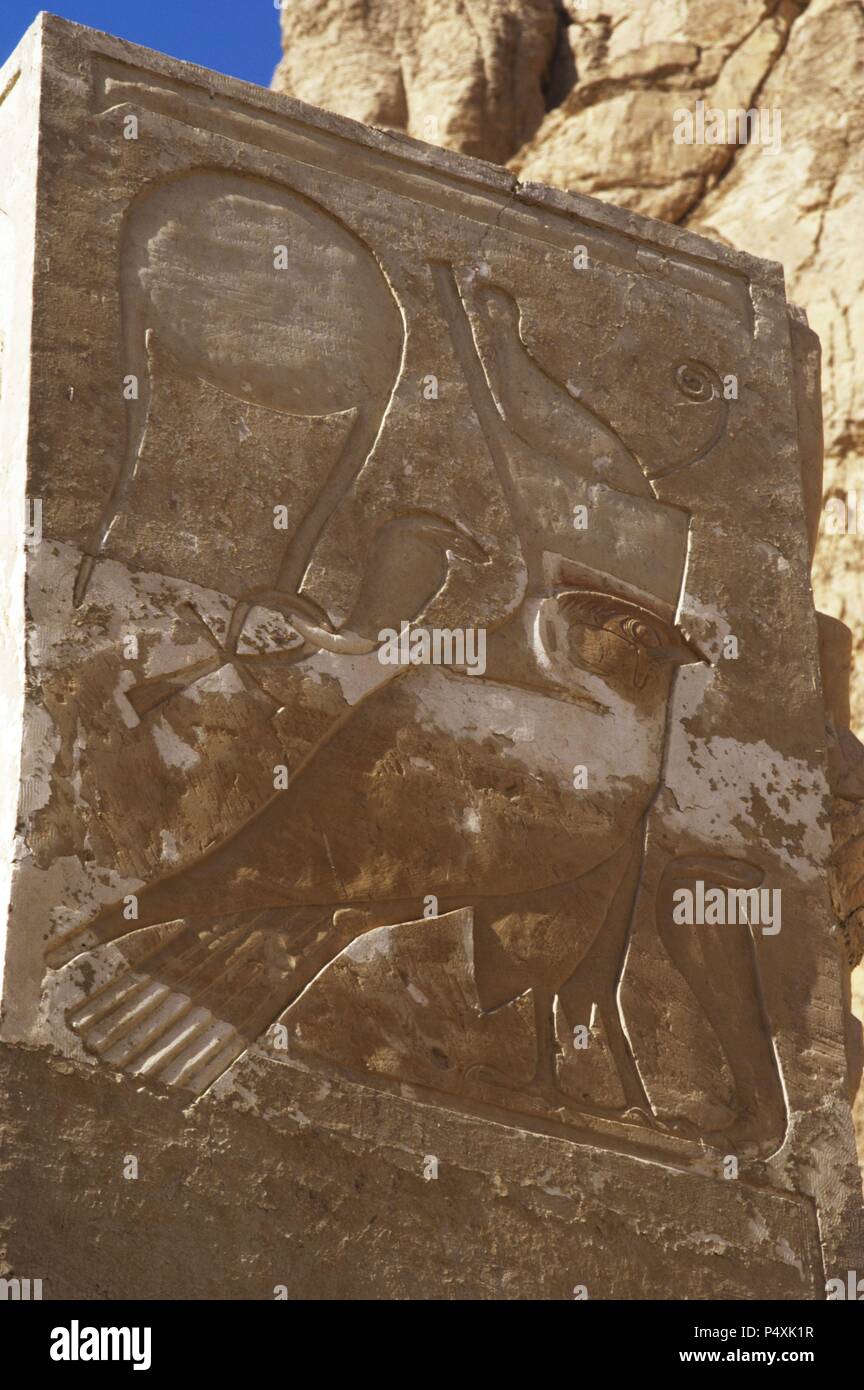 Relief with an inscription in hieroglyphics. Solar disk with snake ...