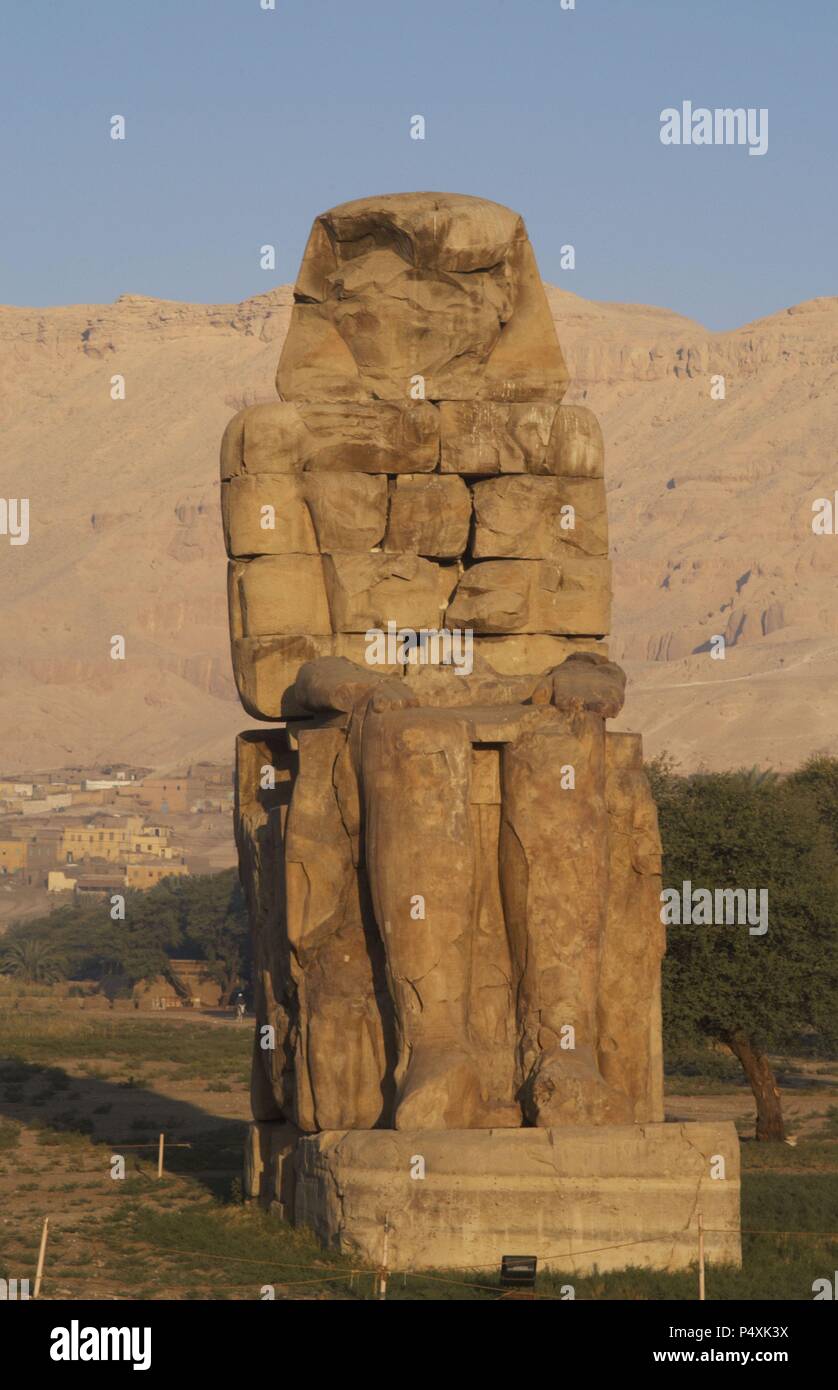 Colossi of Memnon. Stone statues depicting pharaoh Amenhotep III (14th ...