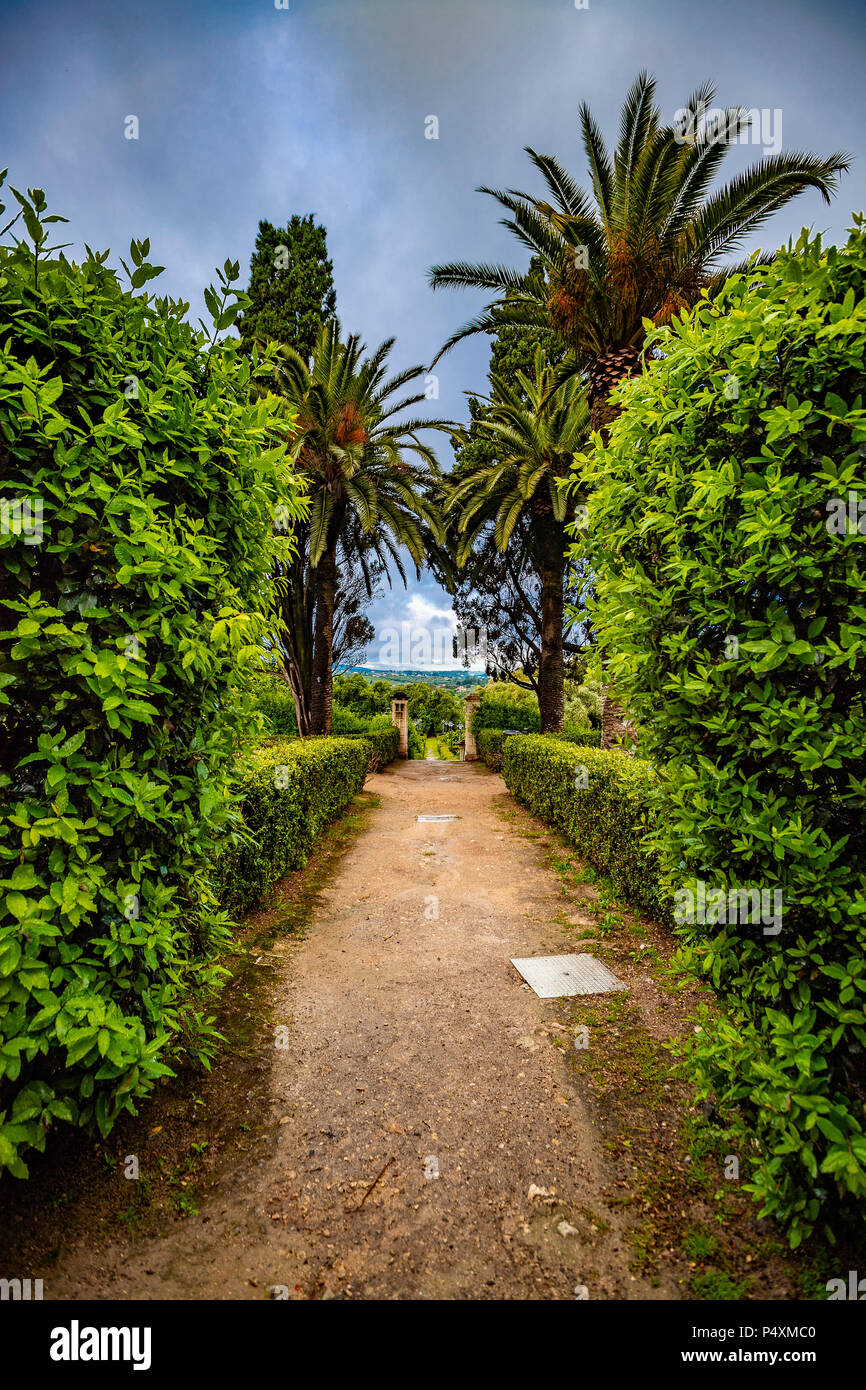 Italy Sardinia Sassari Monserrato Park entrance, bordered by cypresses ...