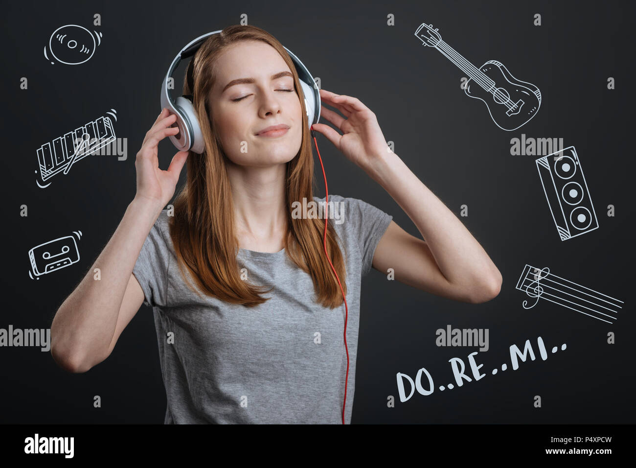 Woman listening music closing hi-res stock photography and images - Alamy