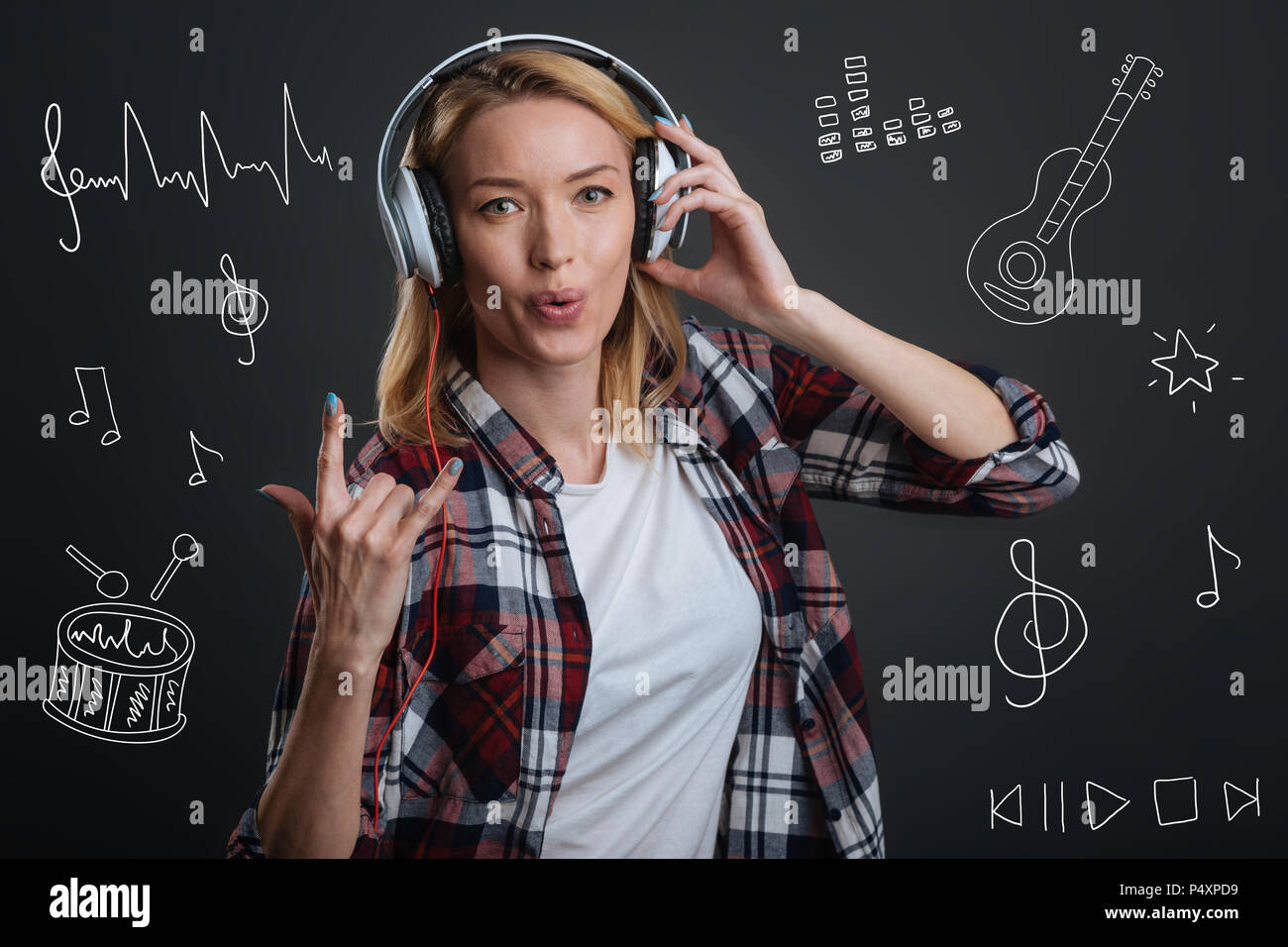 Positive woman feeling great and listening to music Stock Photo - Alamy