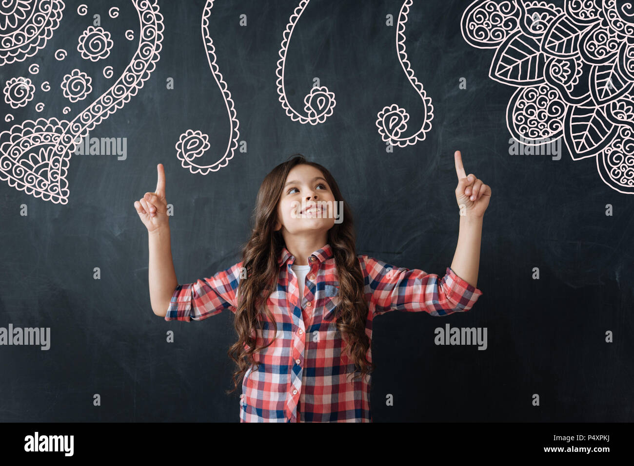 Creative child feeling proud and showing her new pictures Stock Photo ...