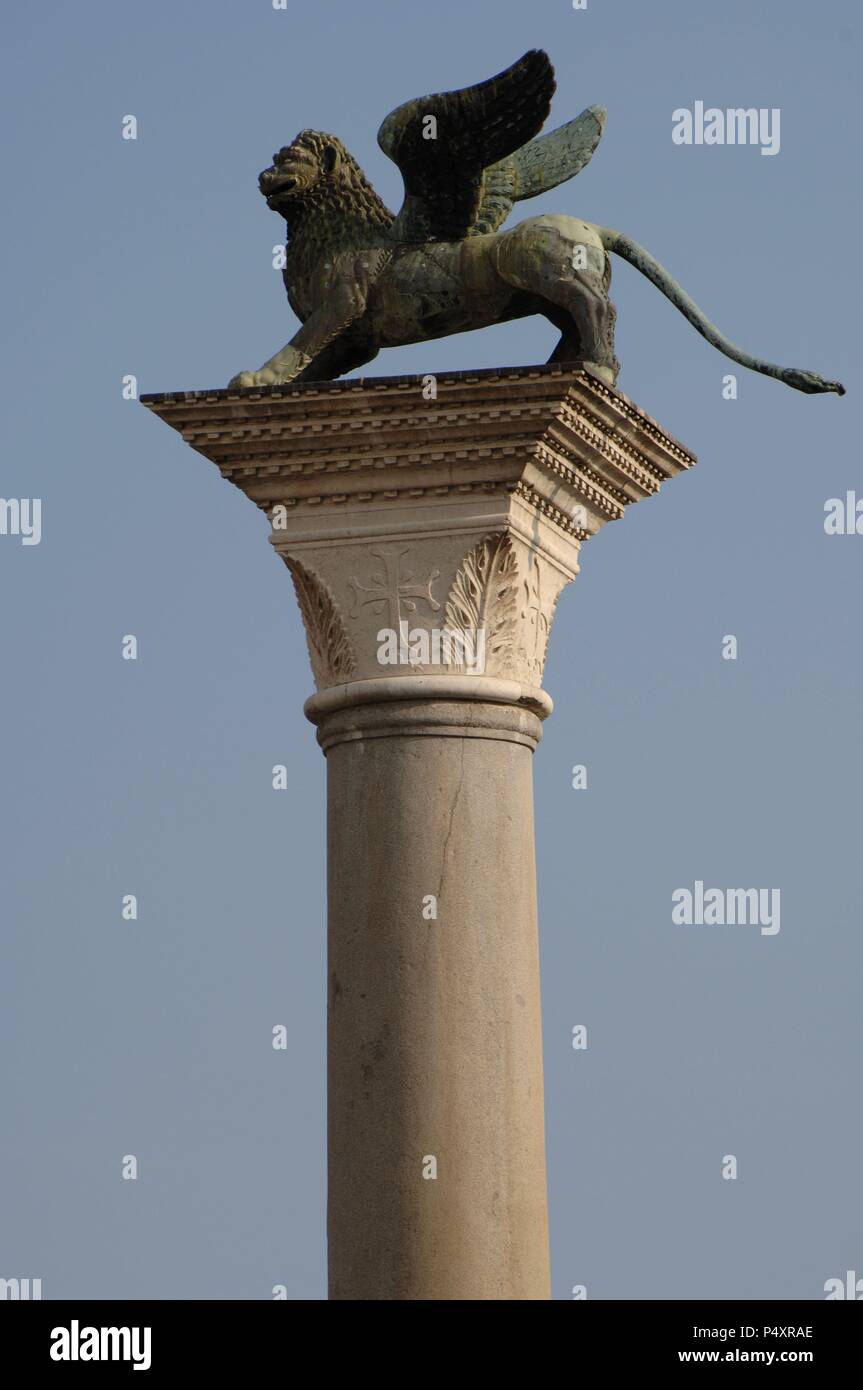 Winged lion statue of Saint Mark on a granite column in the Piazzetta ...