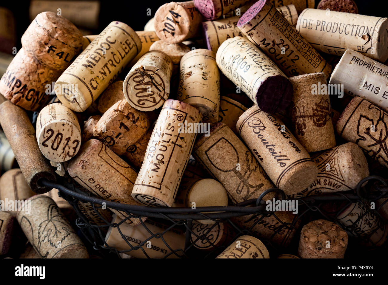 old cork stoppers of French wines in a wire basket Stock Photo - Alamy