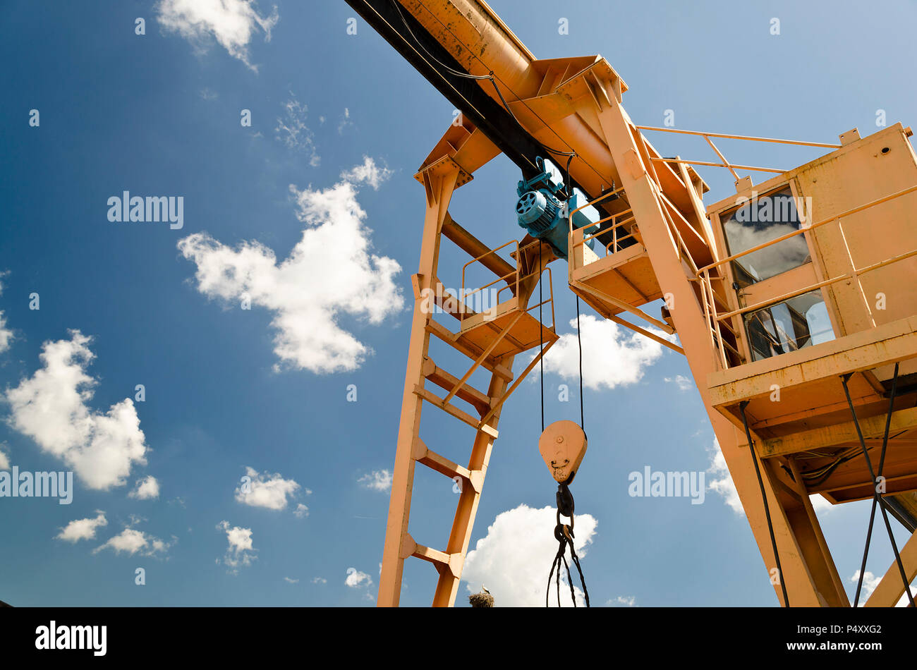 Big lifting crane in the factory Stock Photo - Alamy