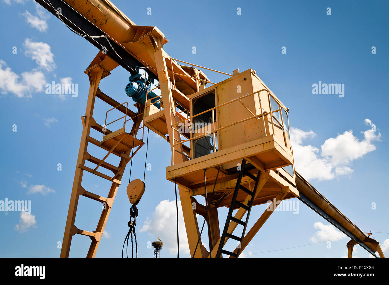 Big lifting crane in the factory Stock Photo - Alamy
