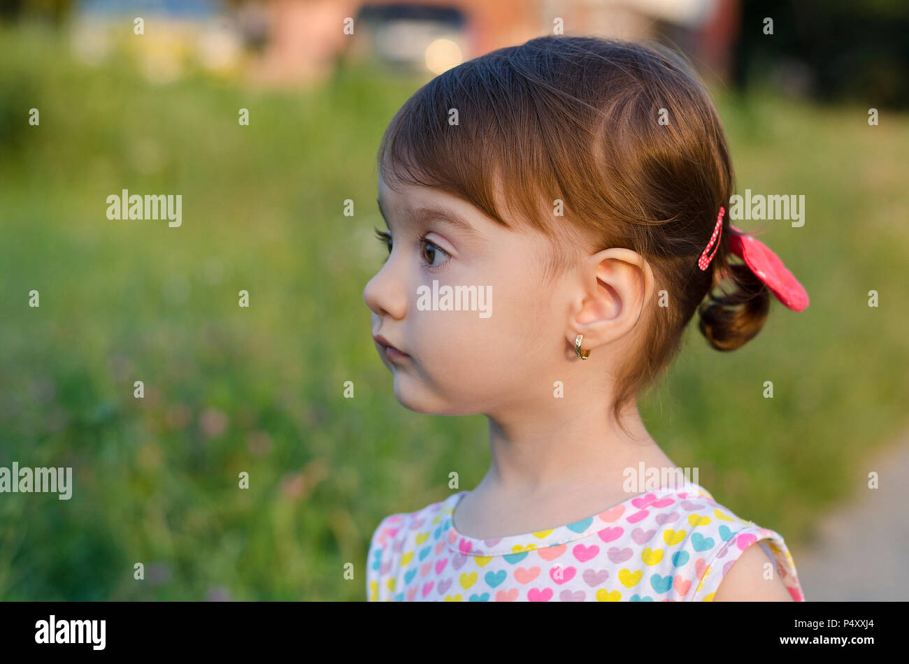 Small angel beauty with sparkling sunset in her eyes Stock Photo - Alamy
