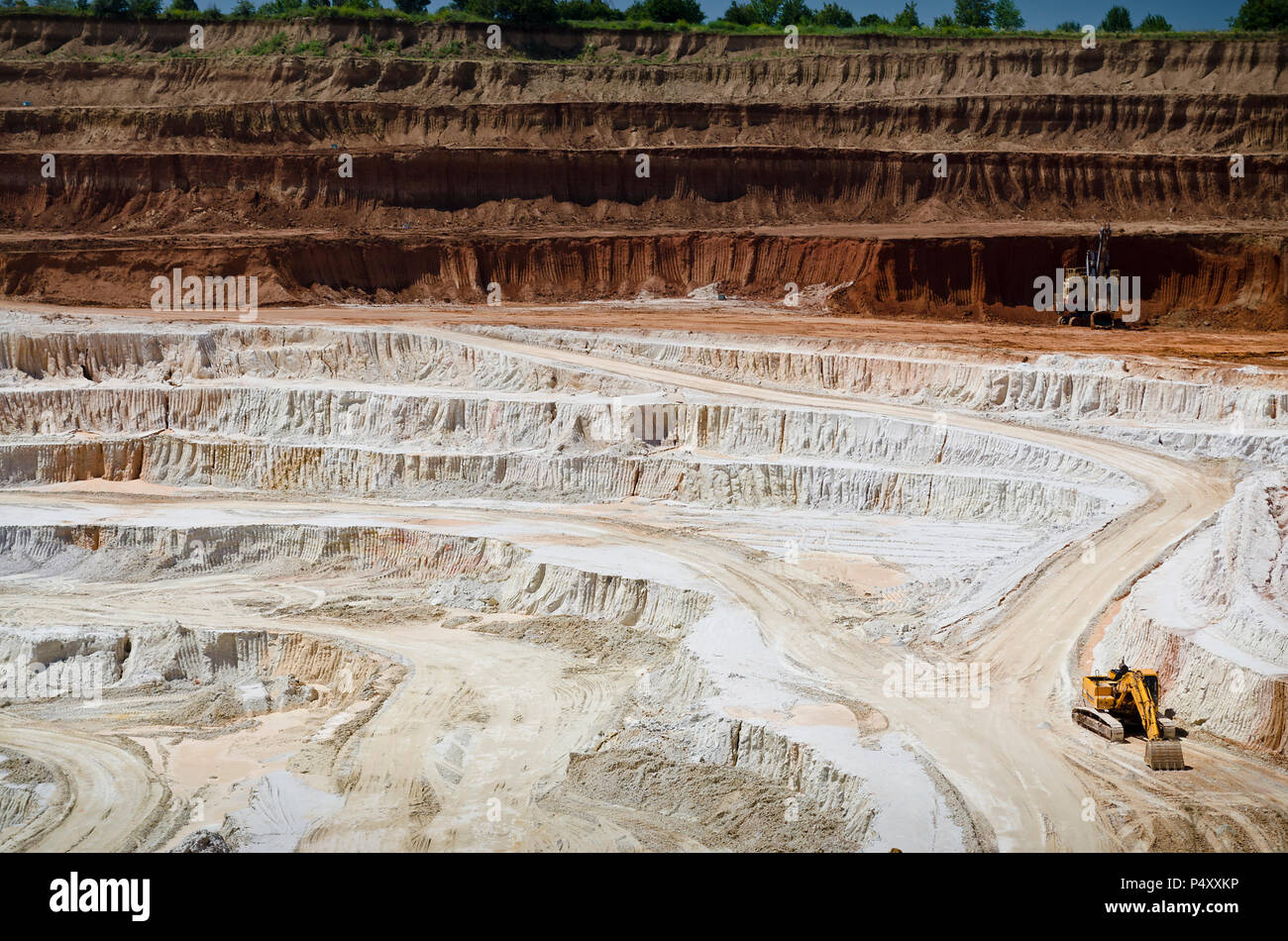 Stone quarry with excavate - Open pit mine Stock Photo - Alamy