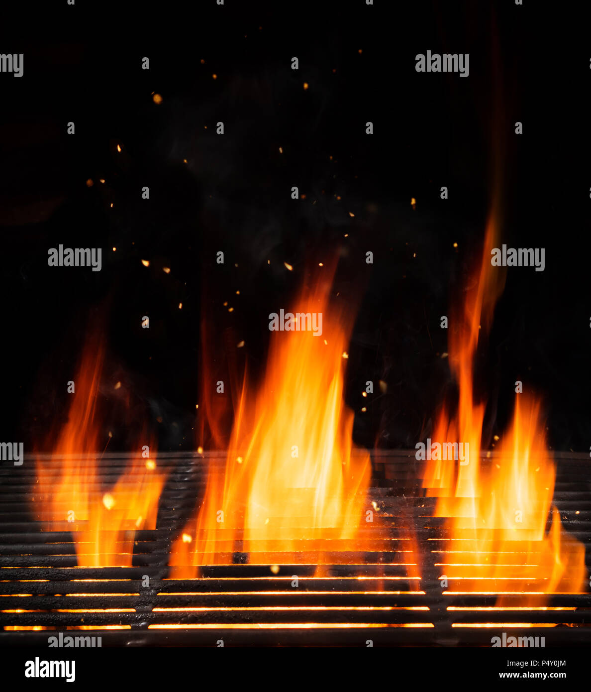 Empty grill with cast-iron and flames, ideal for product placement ...