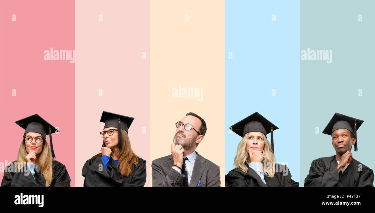 Senior teacher with his graduate students thinking and looking up ...